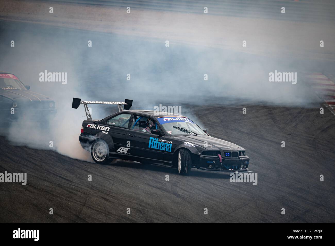Drifting Bmw E36 drift at the Navarra circuit Stock Photo - Alamy