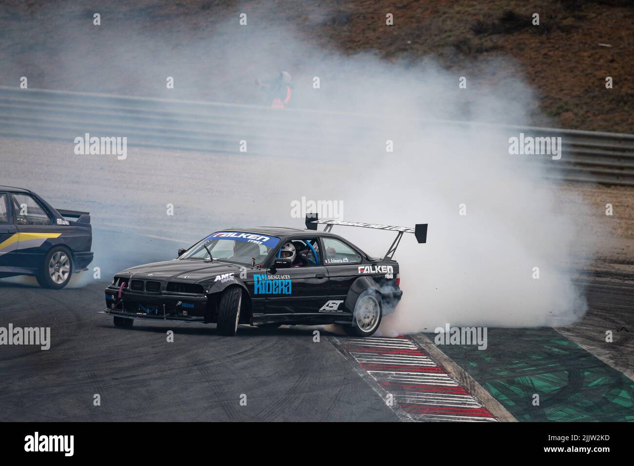 Blac Bmw E36 drift at the Navarra circuit Stock Photo - Alamy