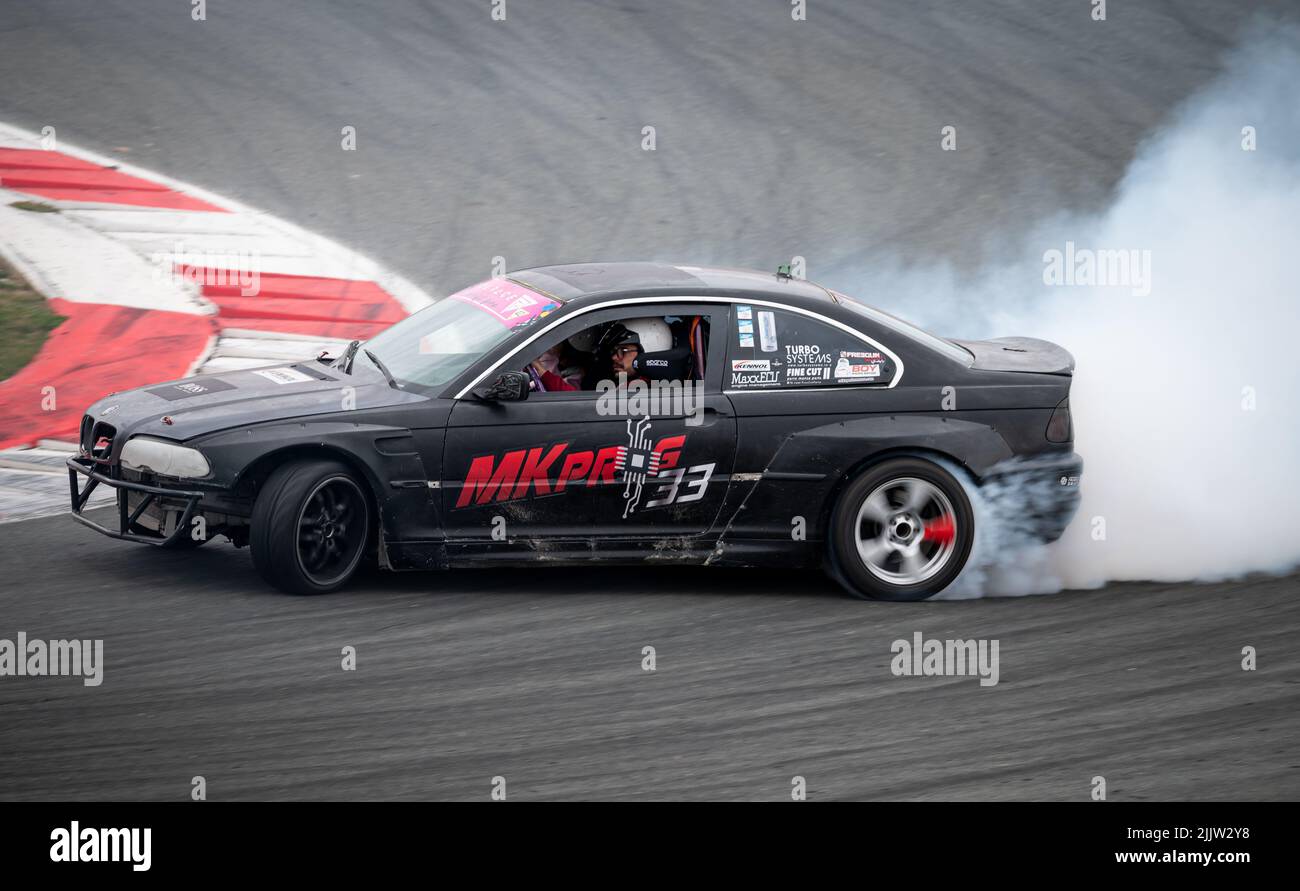 E46 drifting on the racing circuit Stock Photo - Alamy