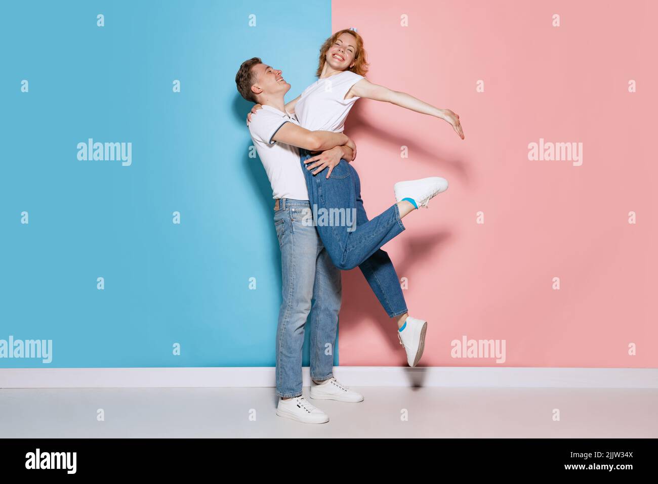 Portrait of young happy and smiling couple, hugging, posing isolated ...