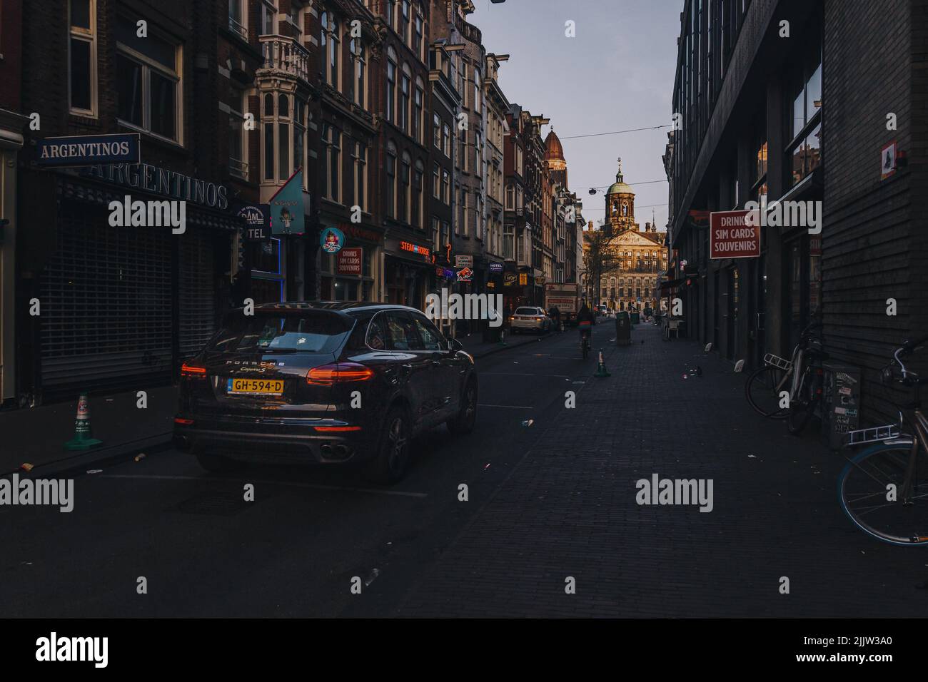 An early morning sight in Amsterdam with cars and bicycles parked on ...
