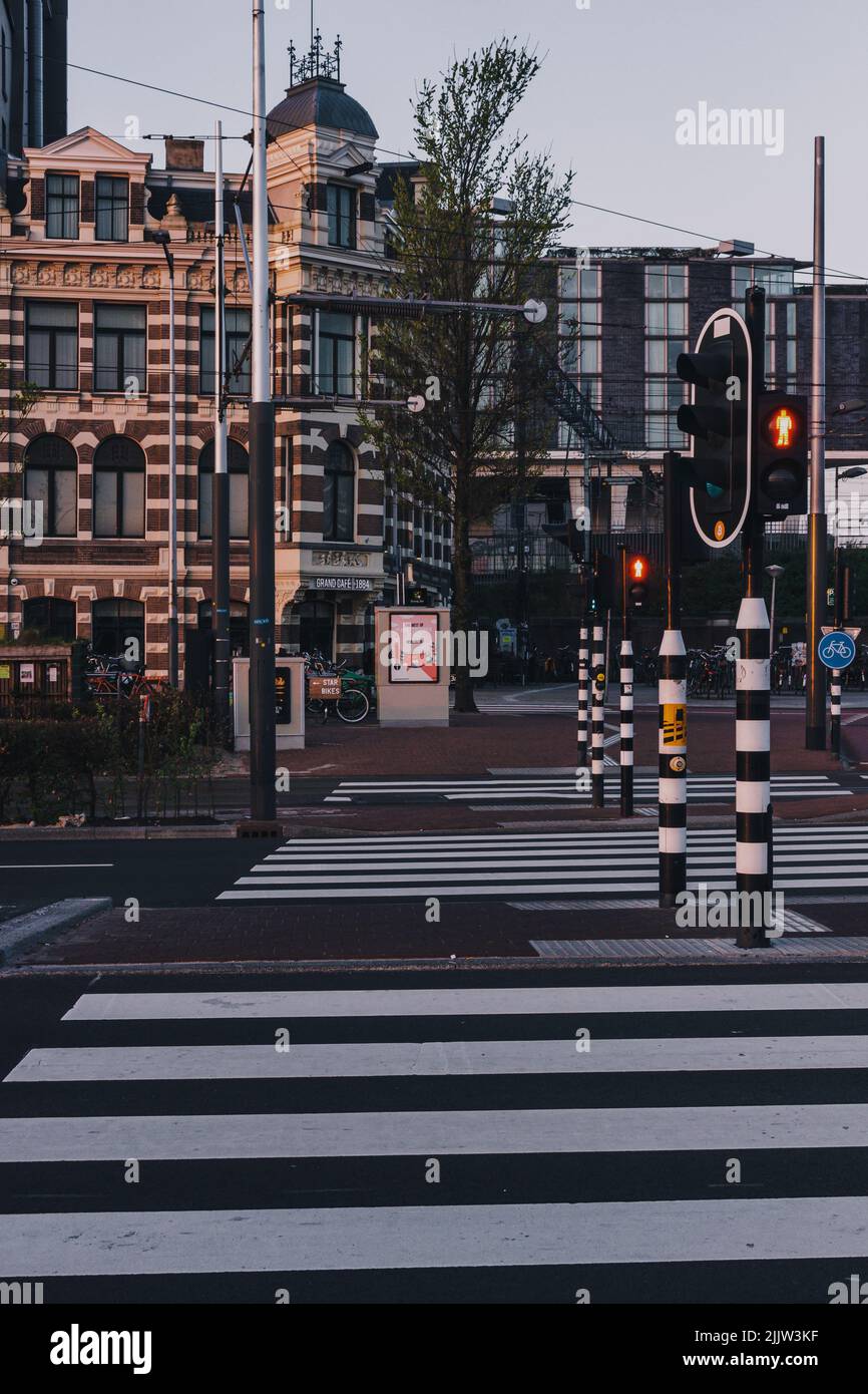 The crosswalk on the road for safety and buildings in Amsterdam Stock ...