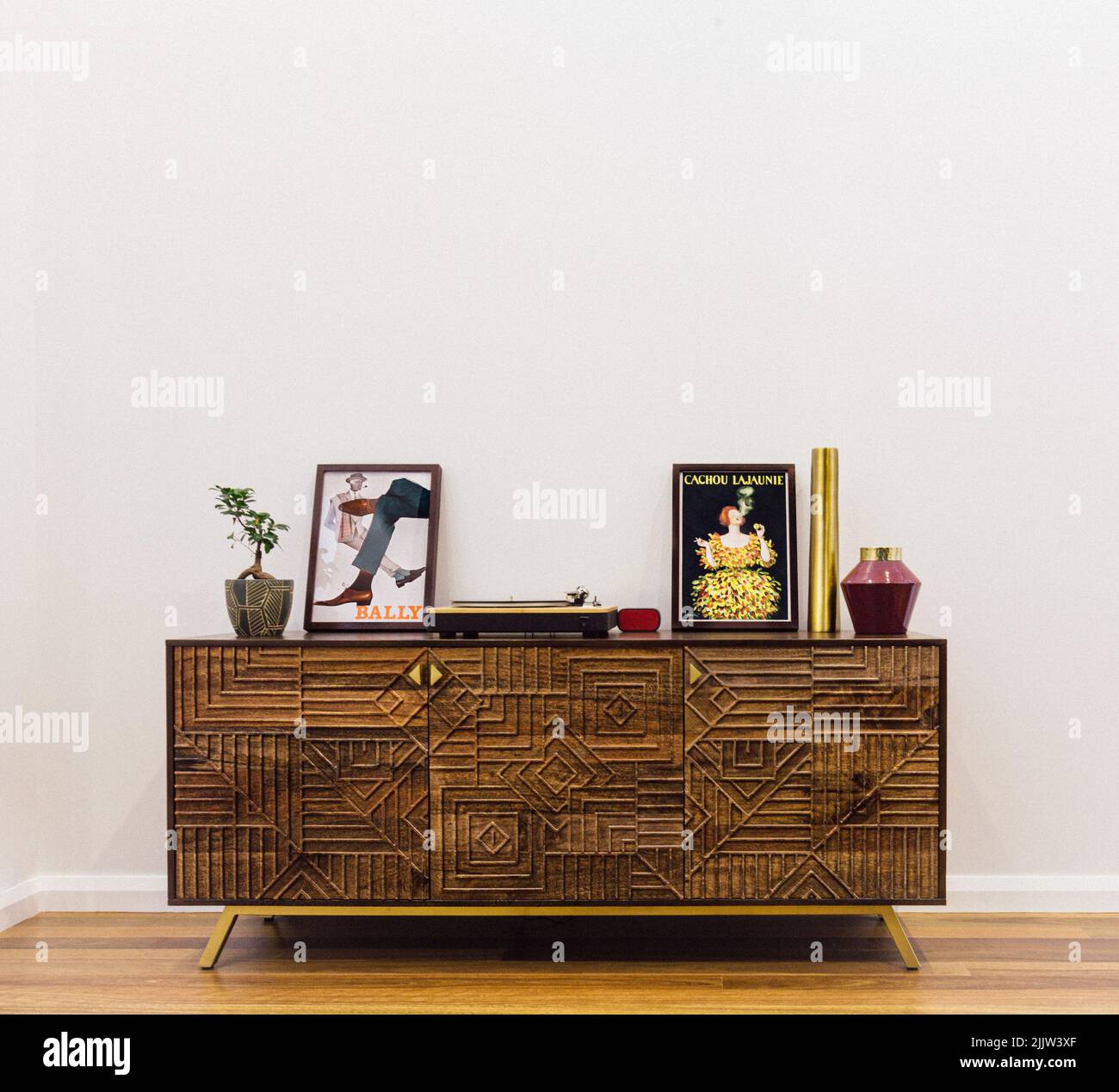 An Australian Interiors fashionable wall unit with vintage wooden chest ...