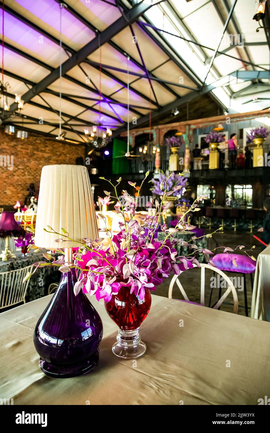 The Purple themed decor in the venue for the party event, at a large ...