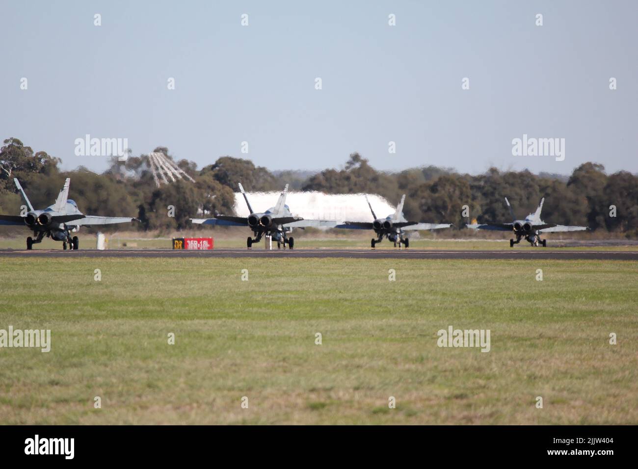 A Four RAAF FA 18 aircrafts taxiing on runway Stock Photo - Alamy