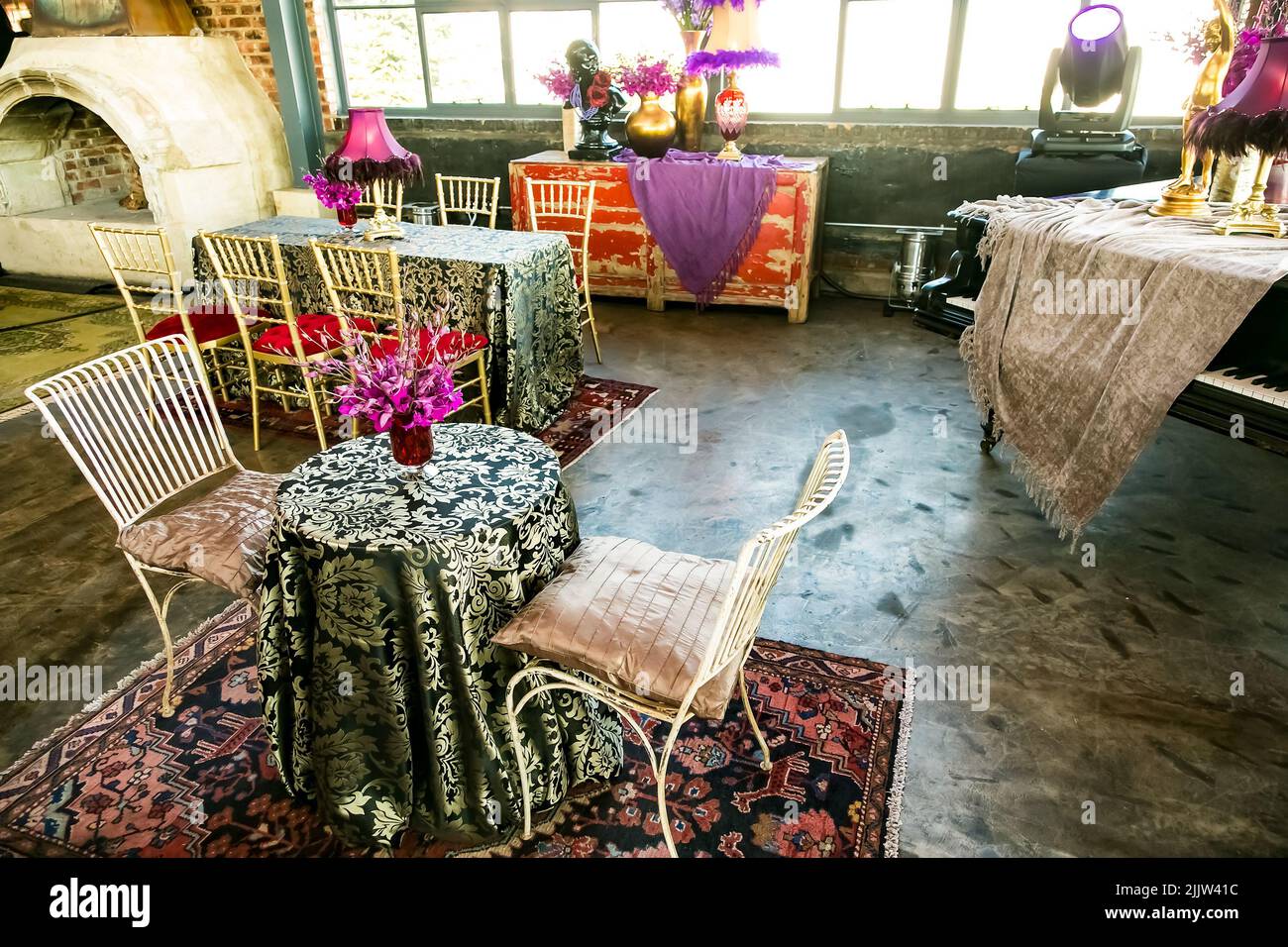 The Purple themed decor in the venue for the party event, at a large ...