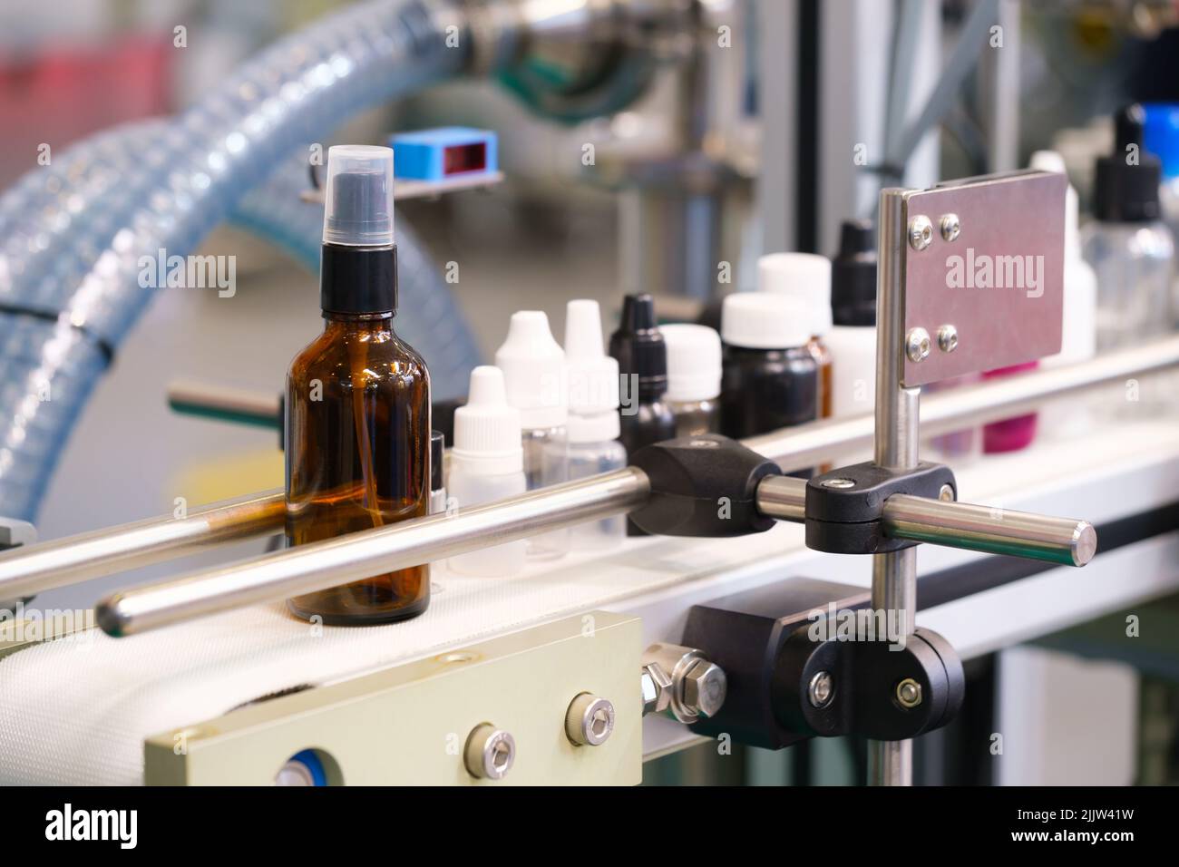 pharmaceutical industry, medicine pills are filling in the bottle on ...