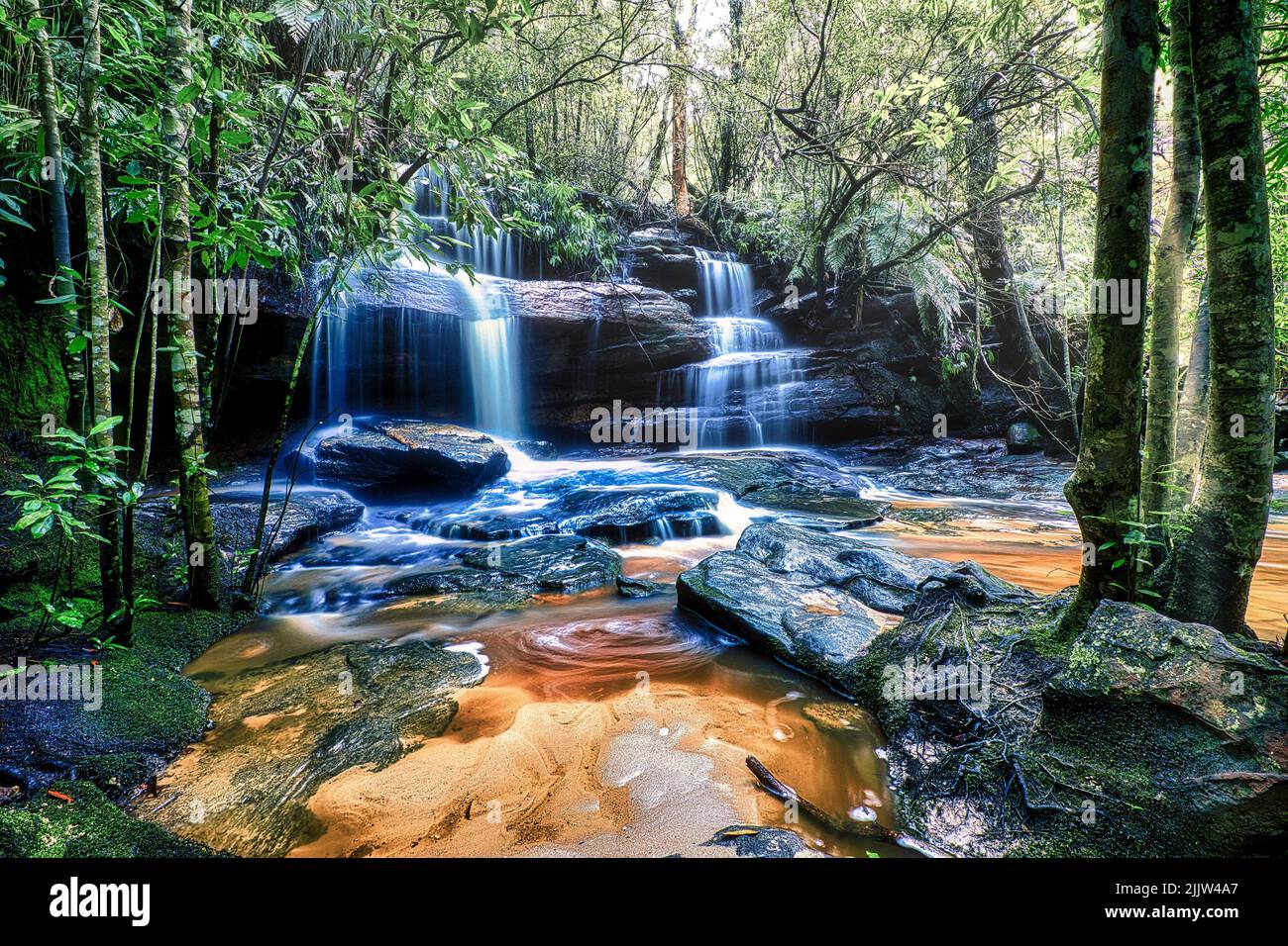 The Somersby Falls flowing over the rocks in the forest in Central ...