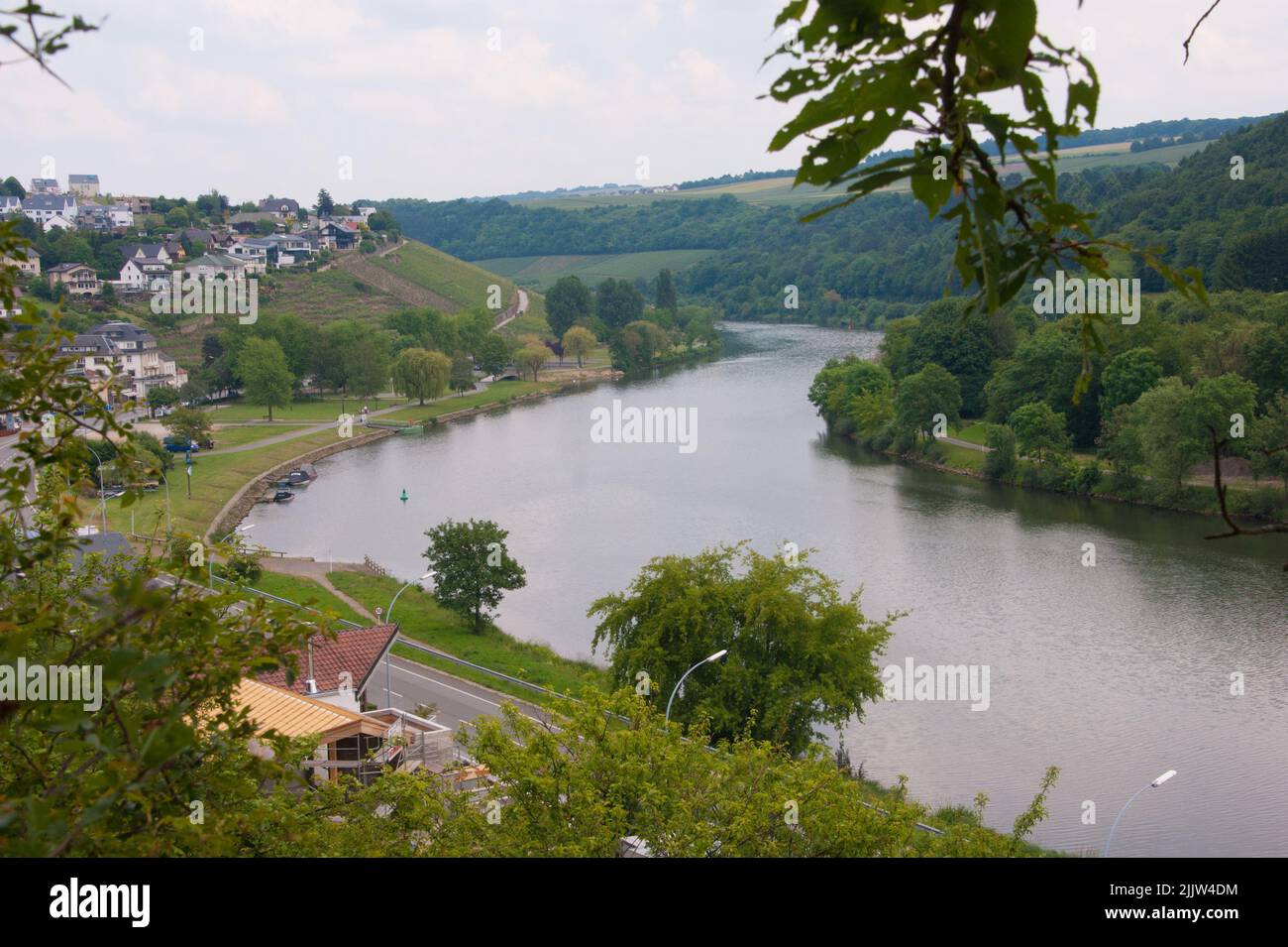 An aerial view of the river Moselle flowing aside Ehnen town ...