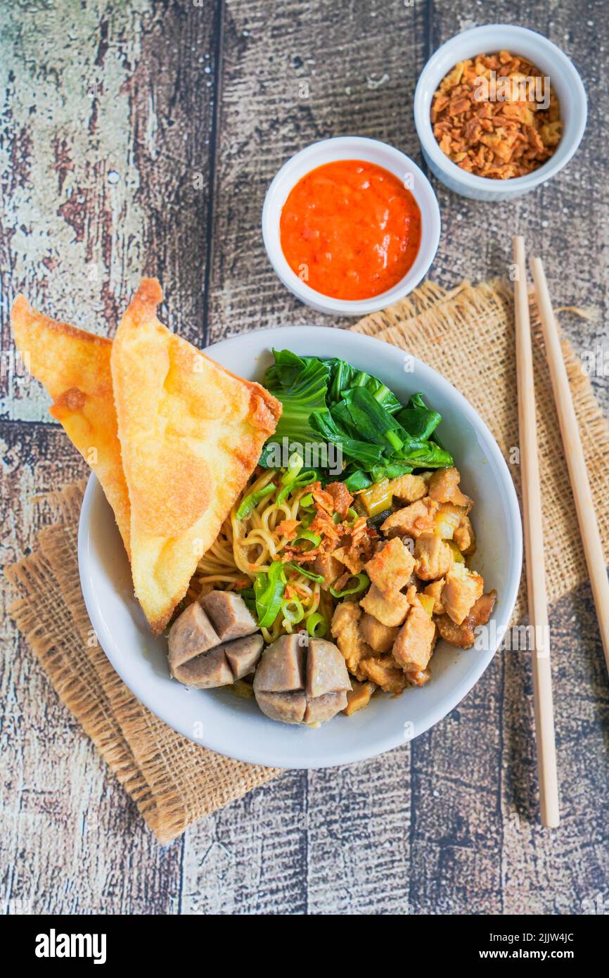Indonesian street food, mie ayam bakso, noodles with chicken and served ...