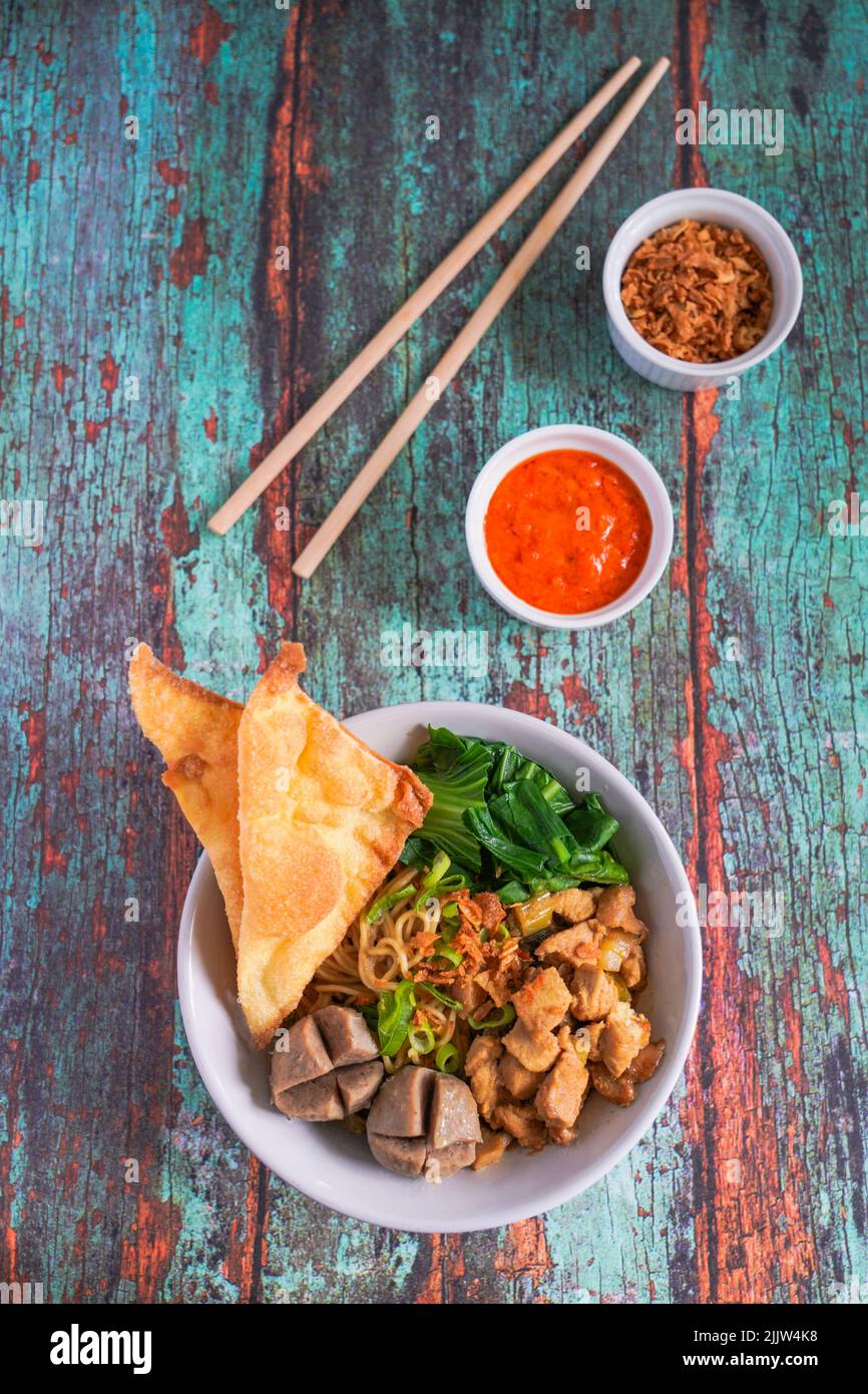 Indonesian street food, mie ayam bakso, noodles with chicken and served ...