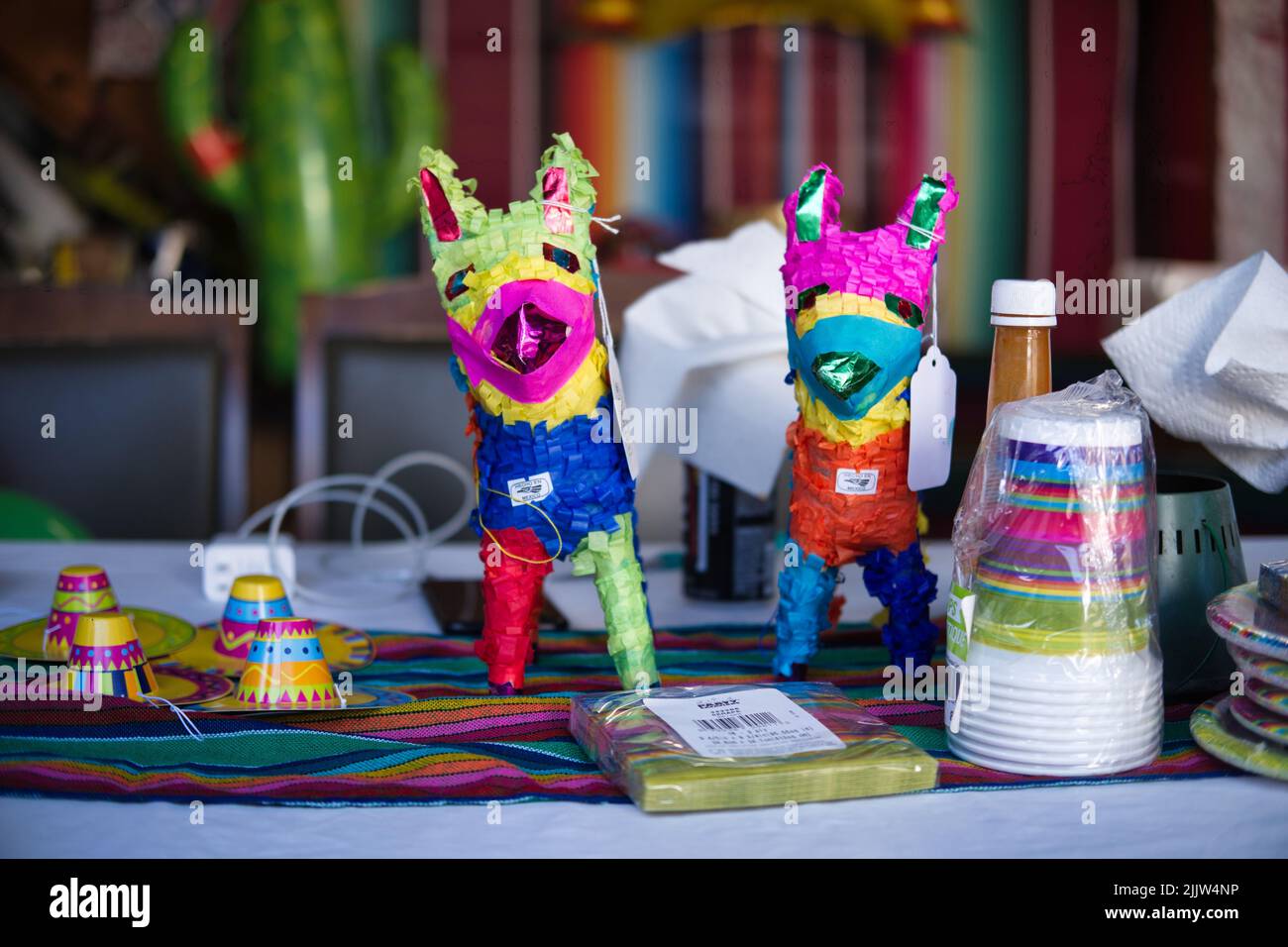 A closeup shot of two colorful Mexican small pinatas for parties on the ...