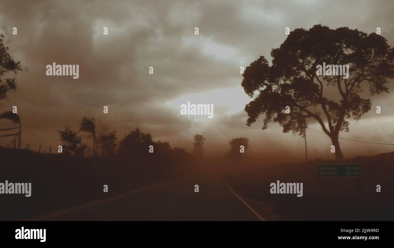 deserted street with red earth cloud Stock Photo - Alamy