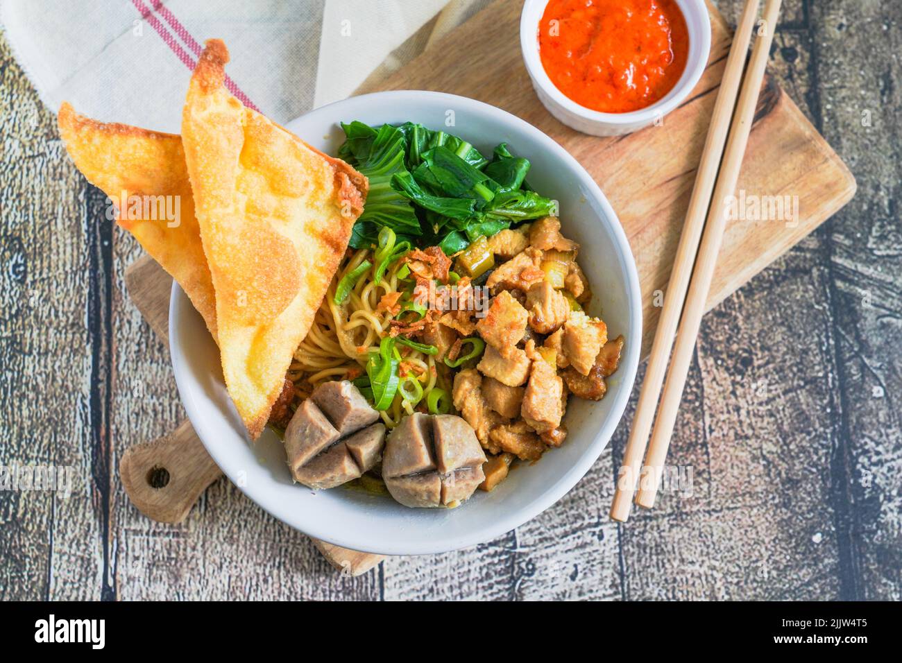 Indonesian street food, mie ayam bakso, noodles with chicken and served ...