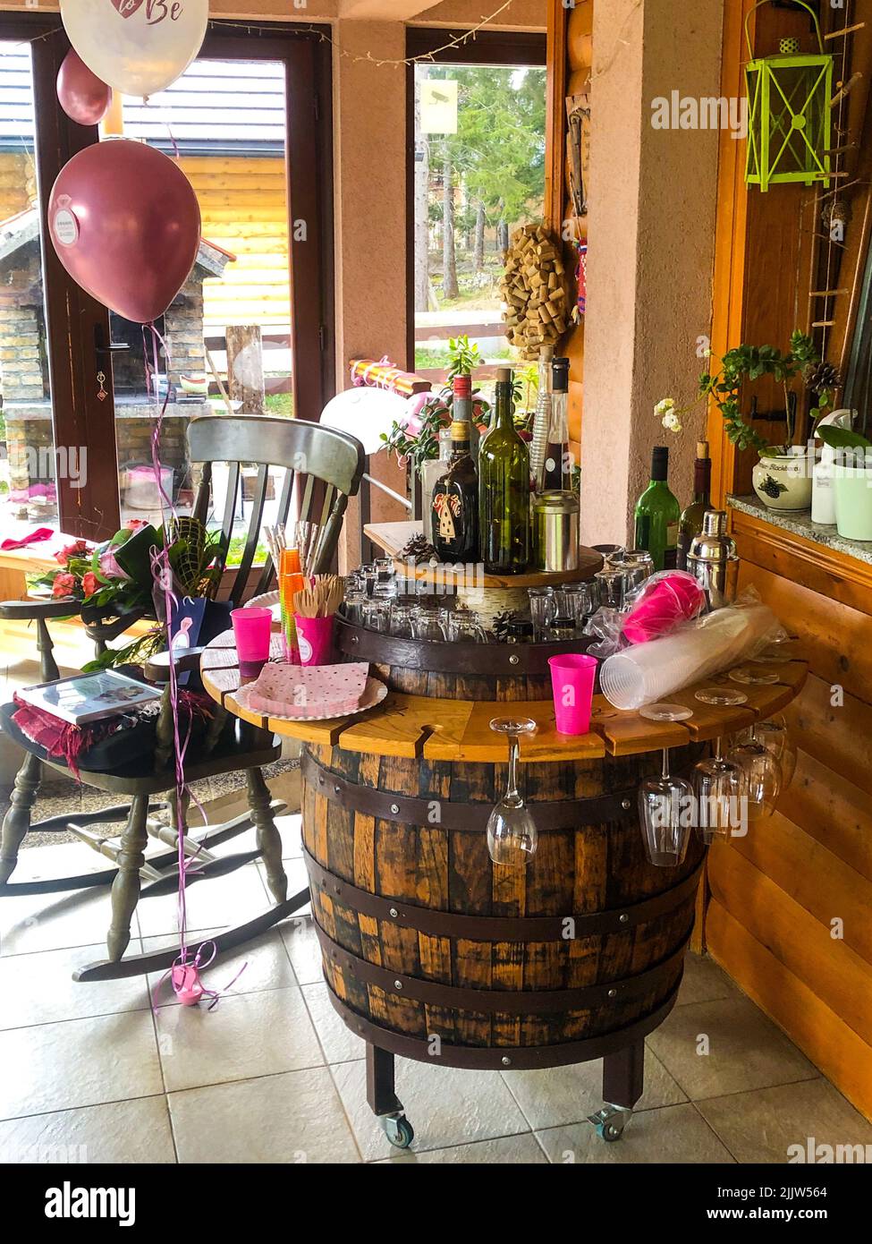A vertical shot of a wooden barrel decorated for a bachelorette party ...