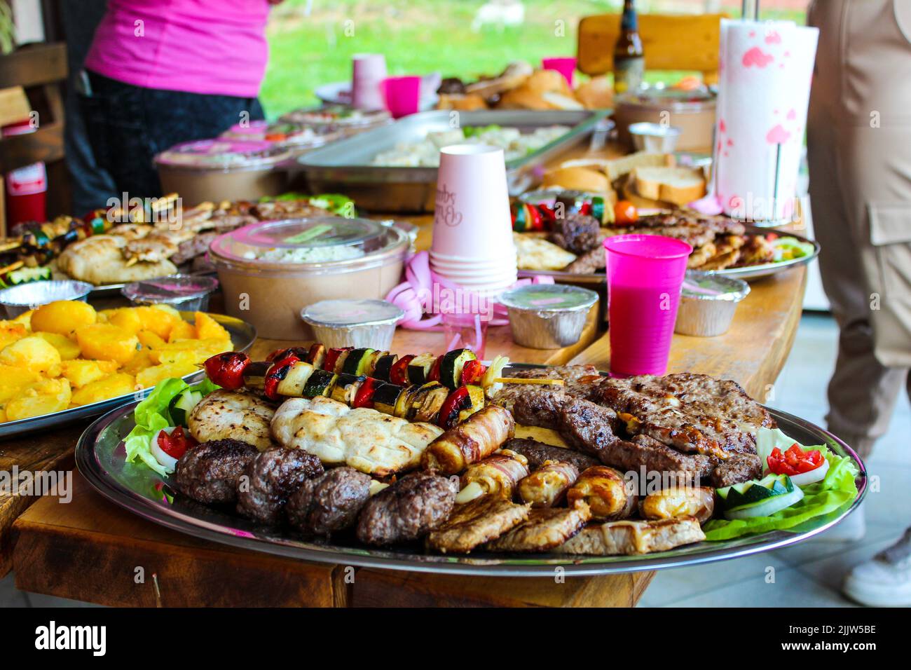 A close-up shot of a prepared table full of yummy meals for a party ...