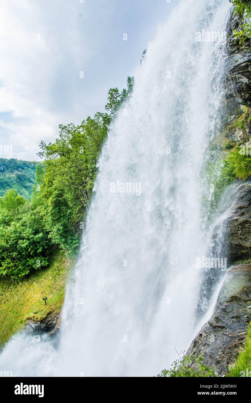 The vertical shot of the Madeira Island Cliffs mountain waterfall ...