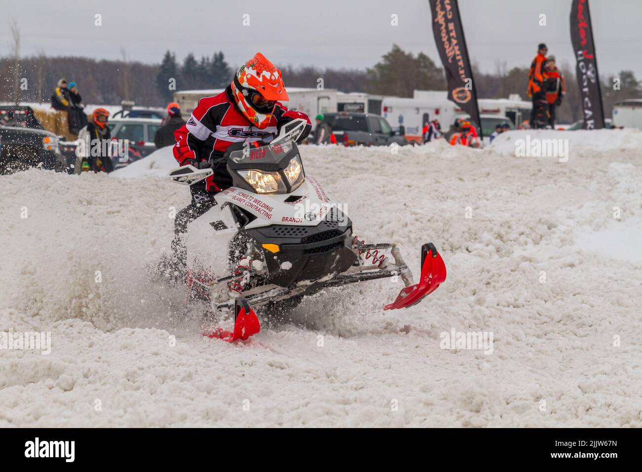 Snowmobiler competing in extreme sports. On a snowmobile, a sportsman ...