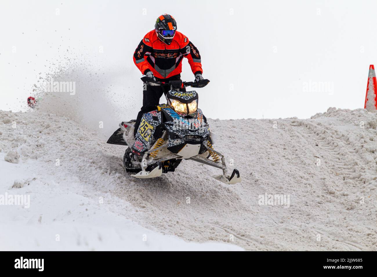 Snowmobile competing in extreme sports. On a snowmobile, a sportsman ...
