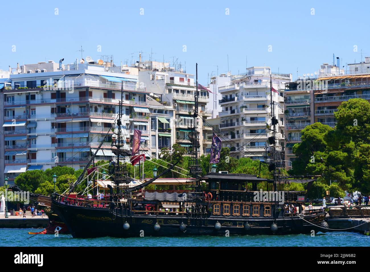 Sea front bulidings with a touristic fake pirate ship, Thessaloniki ...