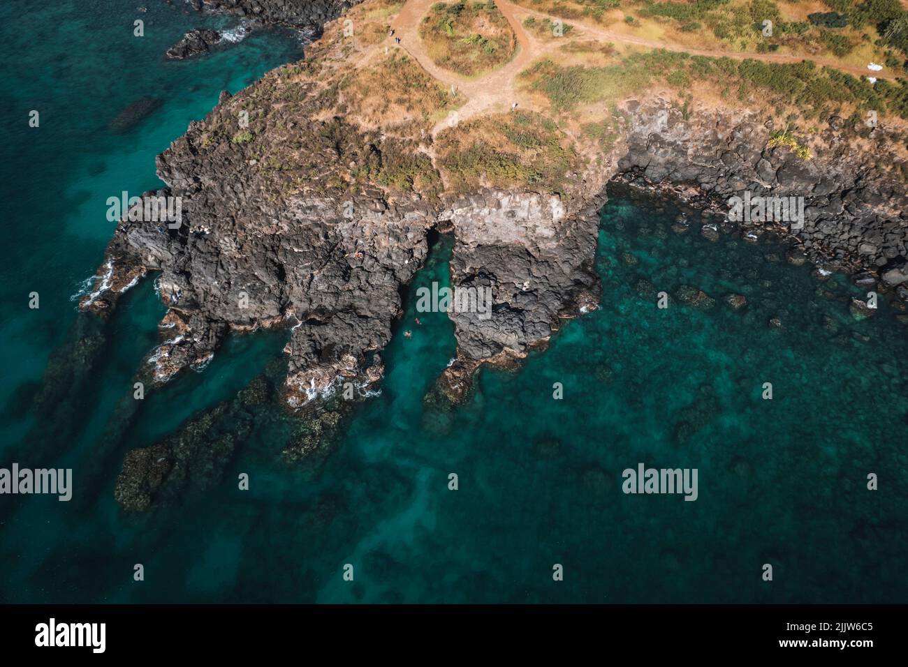 A breathtaking aerial view of magnificent sea cliffs in Mauritius Stock ...