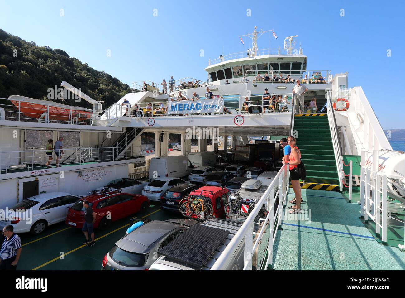 Tourists board the Jadrolinija Kornati and Ilovik ferries at the ...