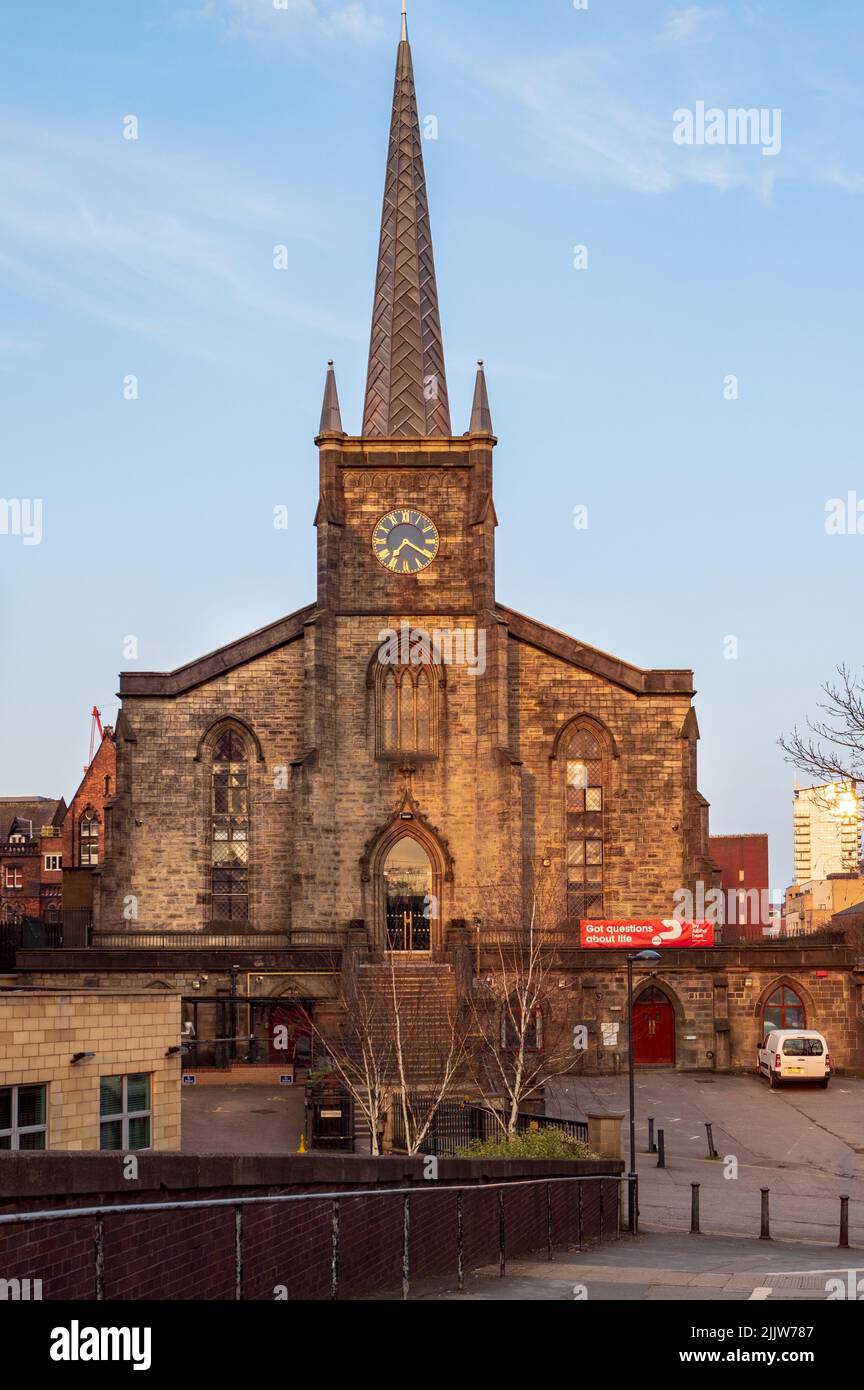 A vertical shot of St George's Church front illuminated by the sun in ...