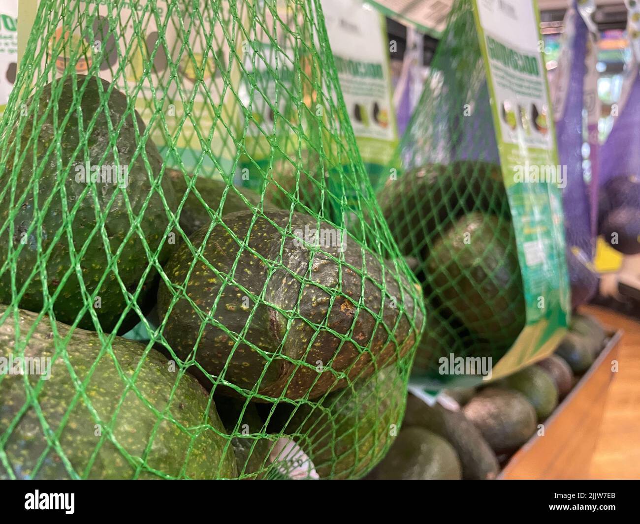 Grovetown, Ga USA - 03 20 22: Retail store hanging bags of Avocados ...