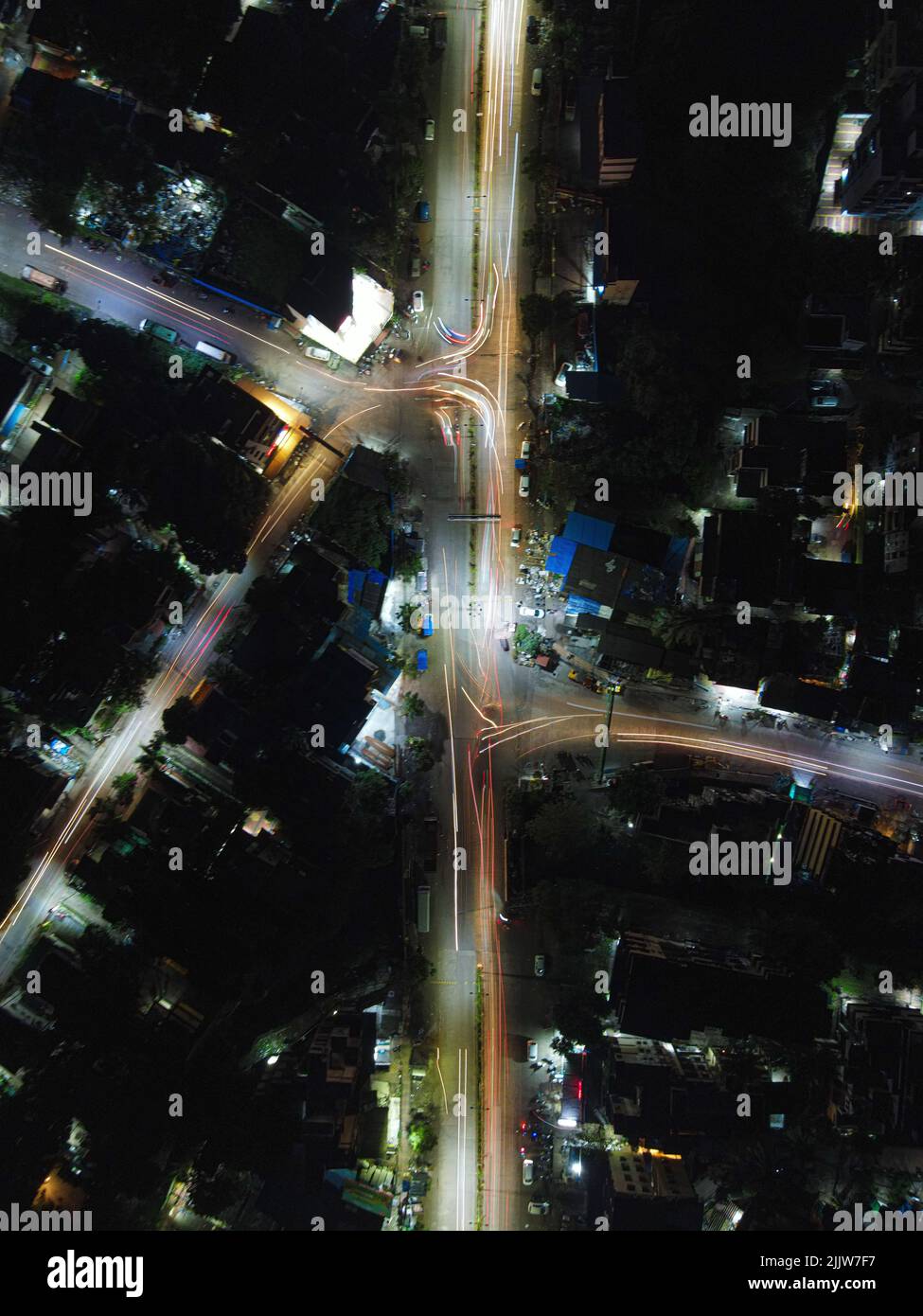 The vertical drone long exposure aerial top down view of the night ...