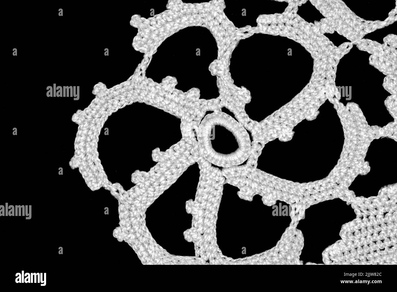 White crochet texture isolated on black background Stock Photo - Alamy