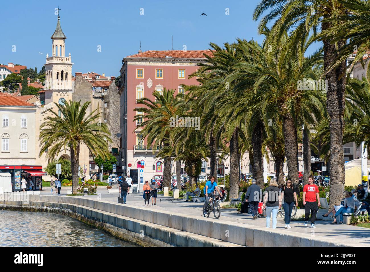 Incidental people walking on a sunny summer day on Riva street in Split ...