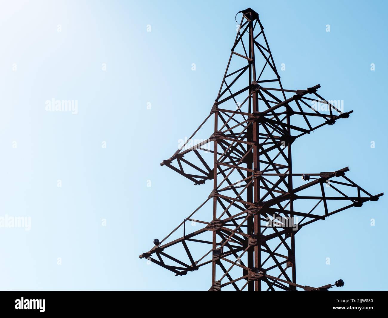 Abandoned electric pole against the sky. Rusty electric pole without ...