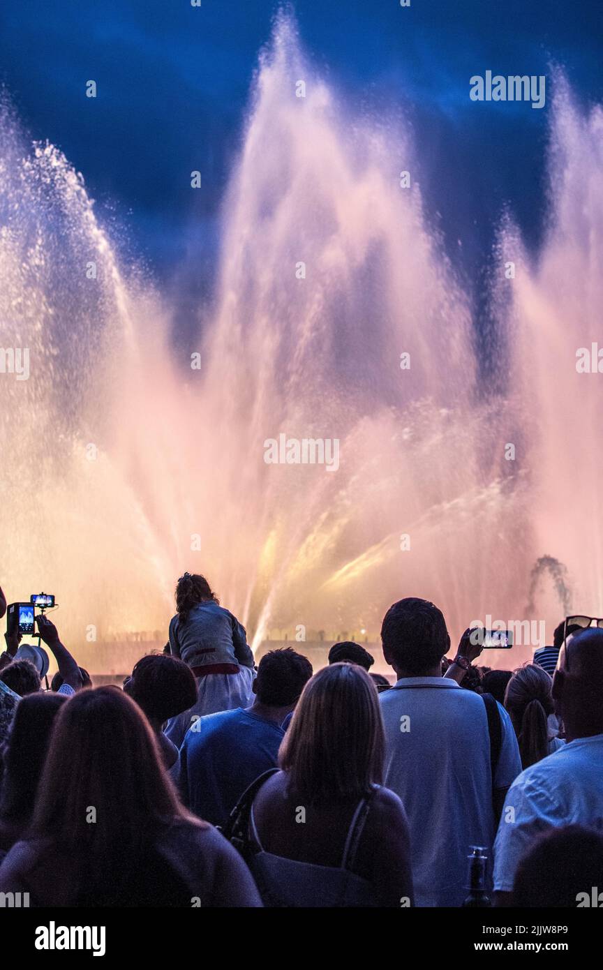 A back view of watching the beautiful show of the Magical Fountain in ...