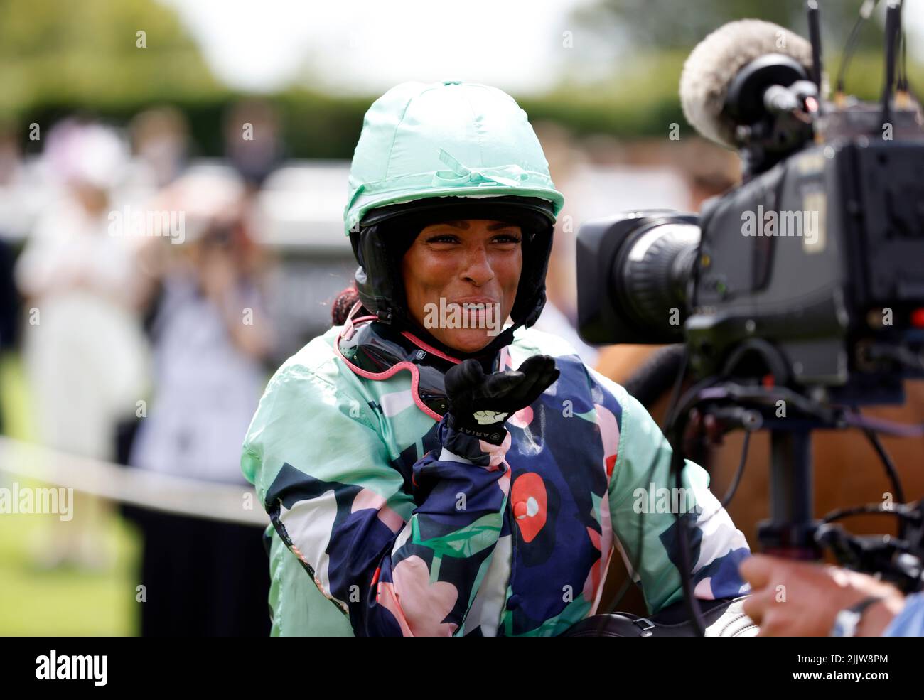 Jockey Ashleigh Wicheard blows a kiss to the camera after her winning ...