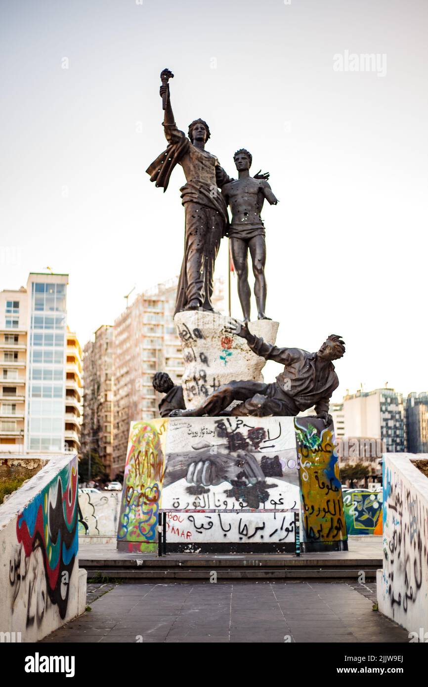 A vertical shot of a Martyr's square with some revolutionary slogans ...