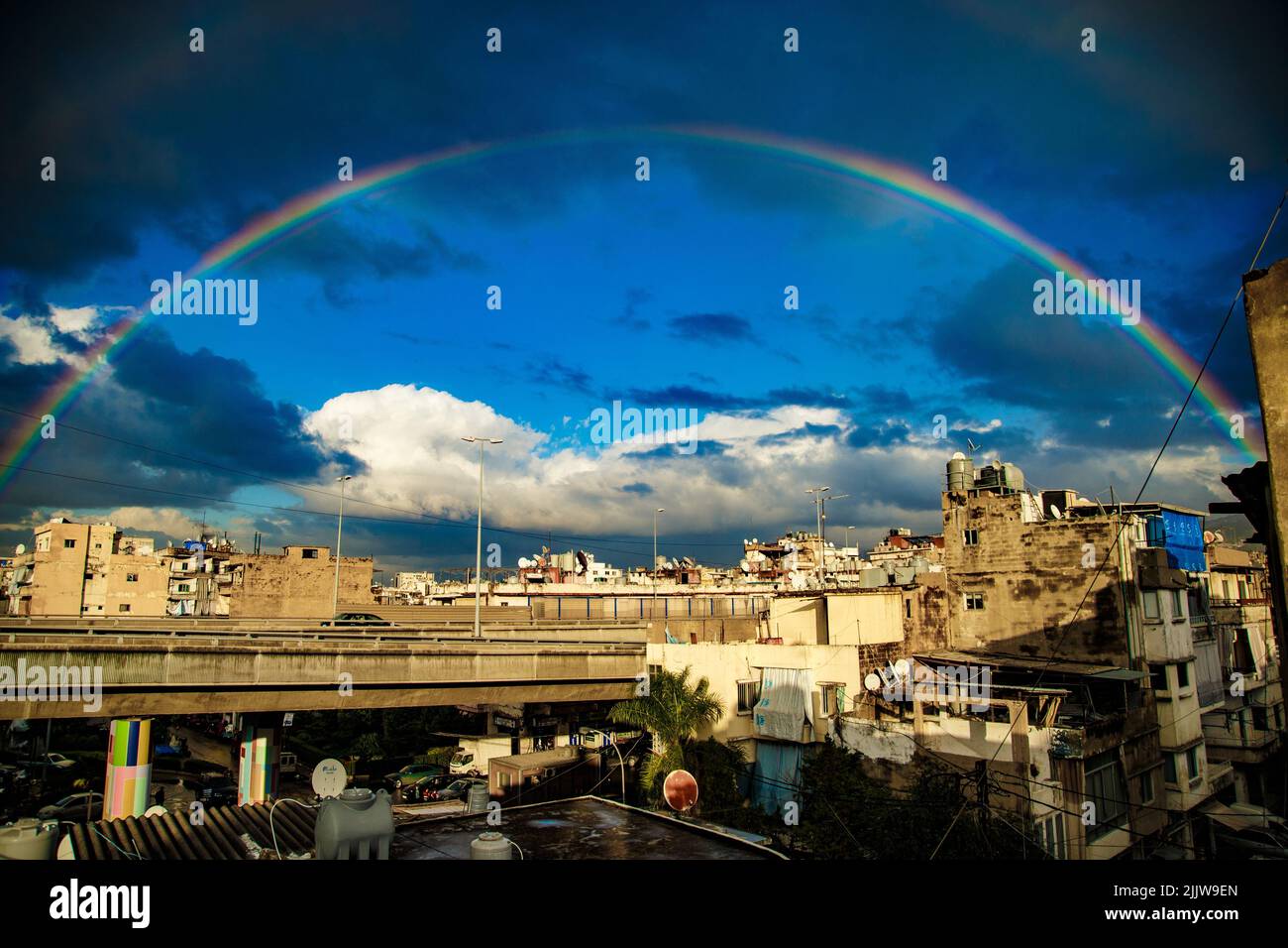 A rainbow over a white house hi-res stock photography and images - Alamy