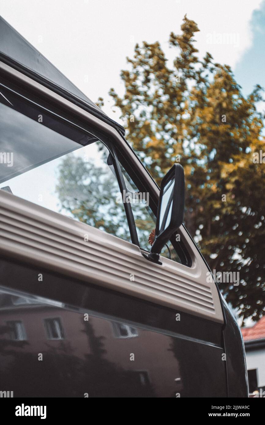 A side view of a gray van parked on the street Stock Photo - Alamy