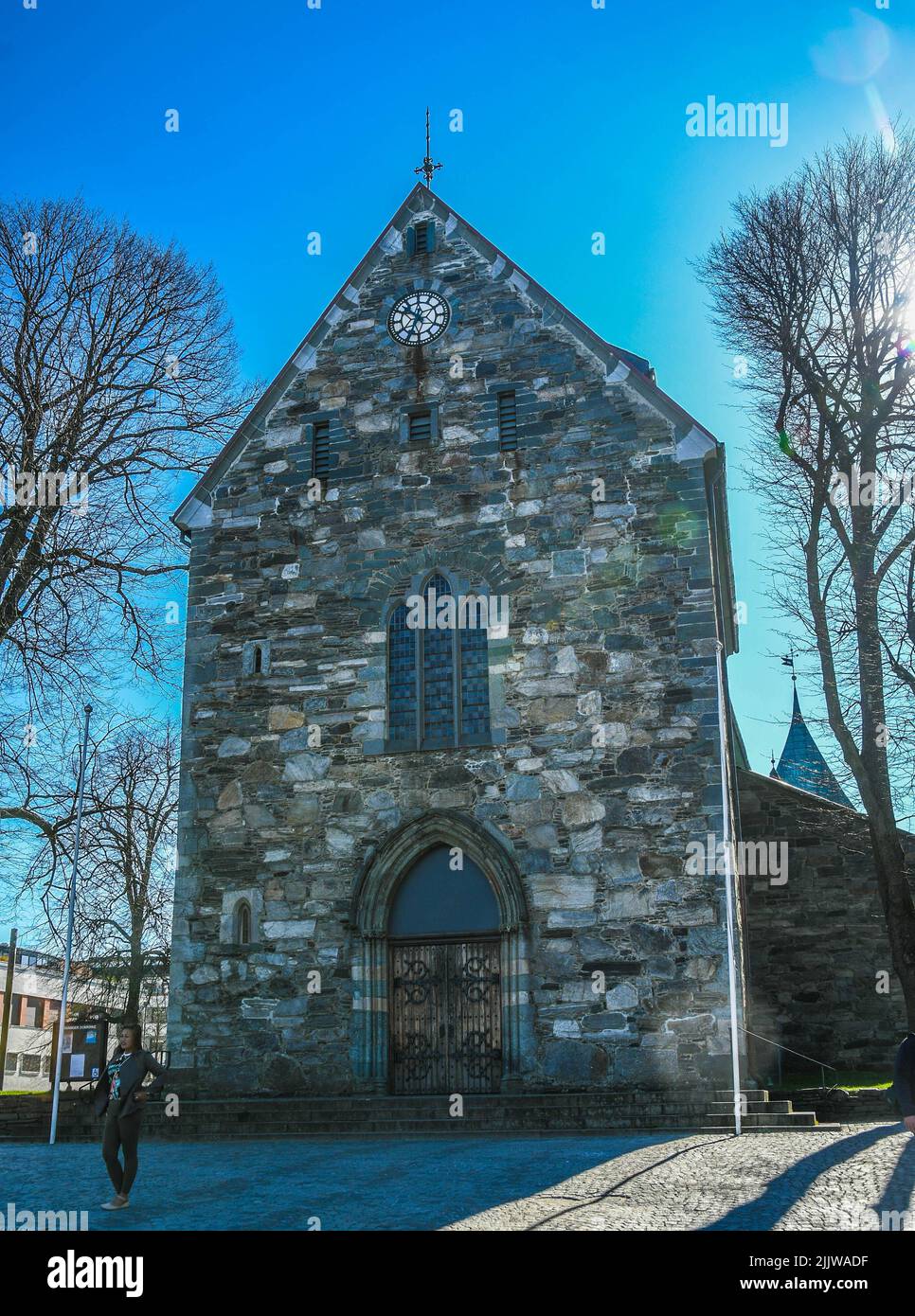 A vertical shot of a historic stone church tower in Stavanger, Norway ...