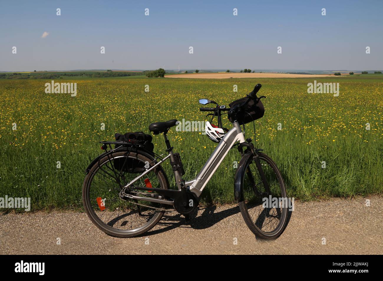 Spring landscape with an e-bike on the way Stock Photo - Alamy