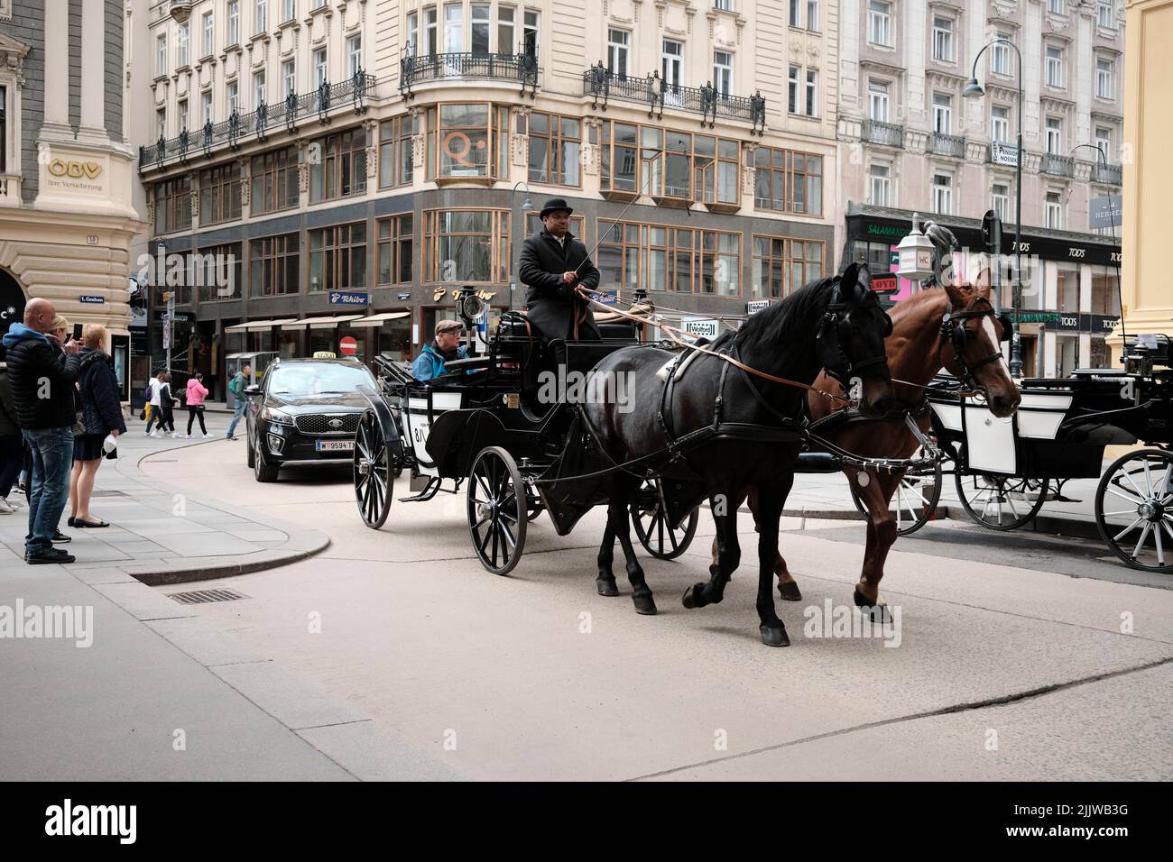 A view of a carriage and cars on a road Stock Photo - Alamy