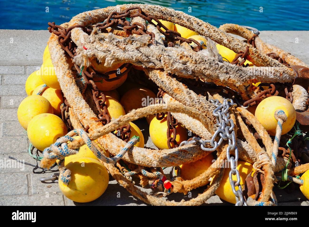 Picture shows ropes, chains and buoys for fishing nets Stock Photo - Alamy
