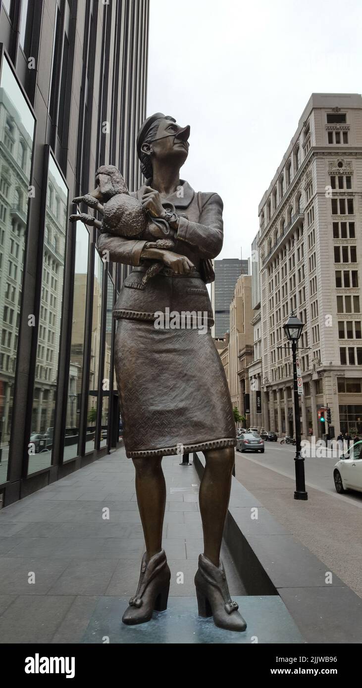 A vertical shot of The English Pug and the French Poodle woman Statue ...