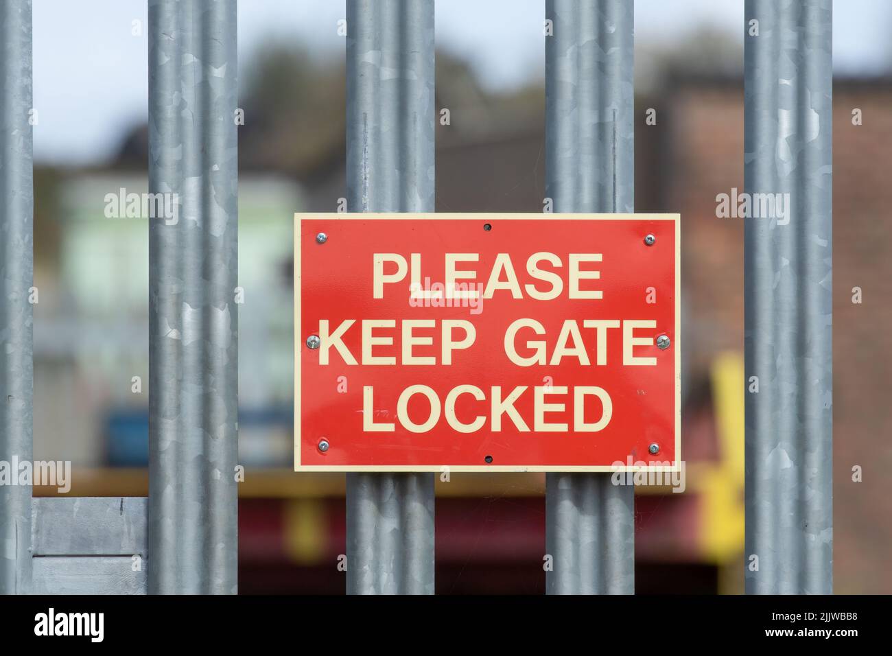 A red sign on a metal gate asking Please Keep Gate Locked in Sculthorpe ...