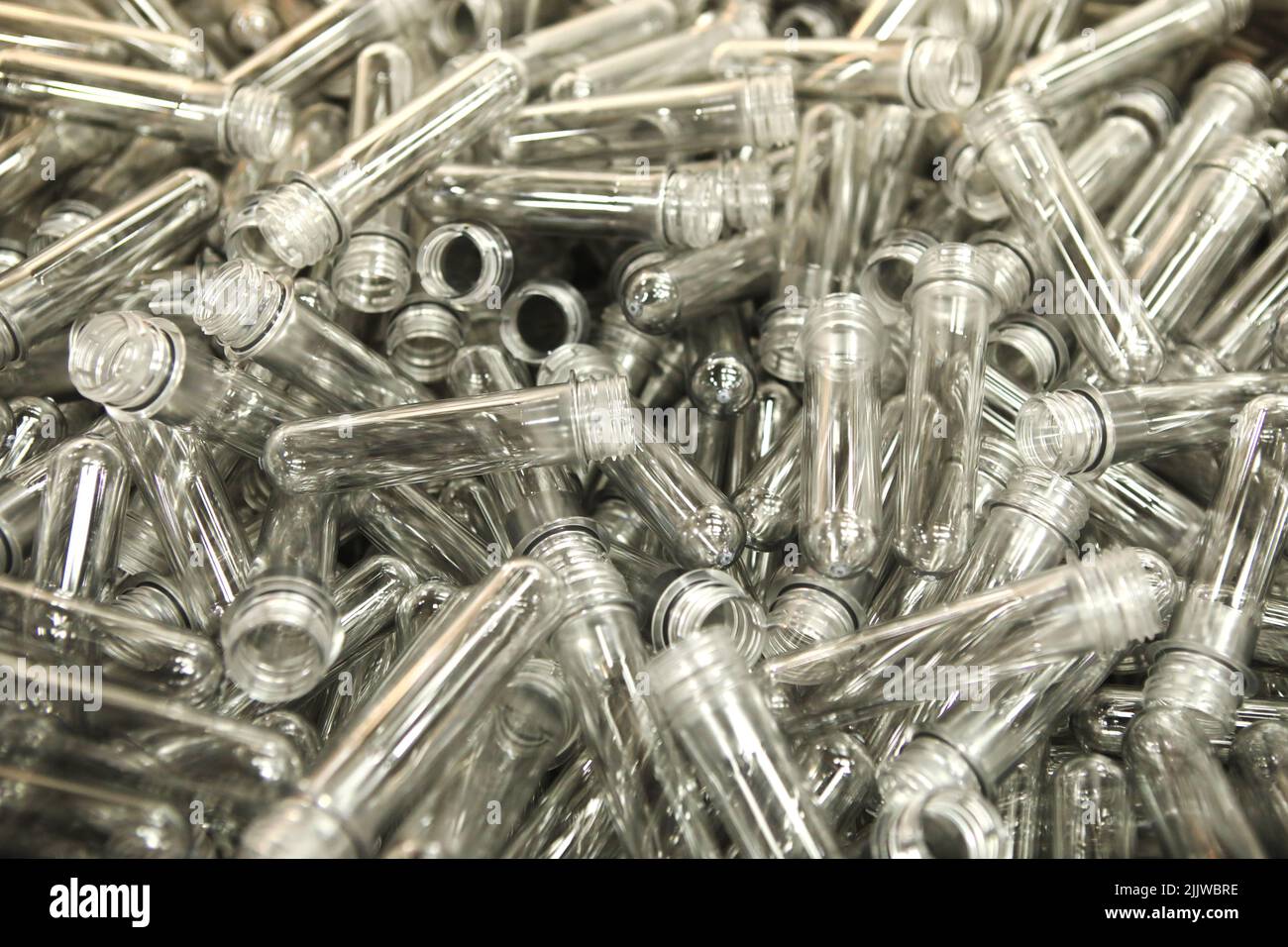 Preform for the manufacture of plastic bottles. Lots of bottles Stock ...