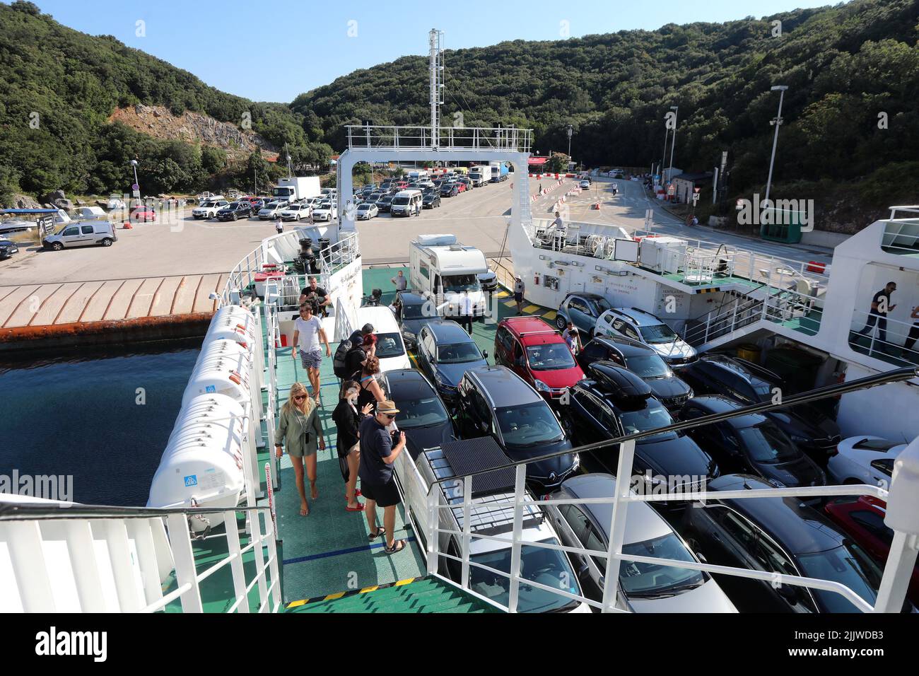 Tourists board the Jadrolinija Kornati and Ilovik ferries at the ...