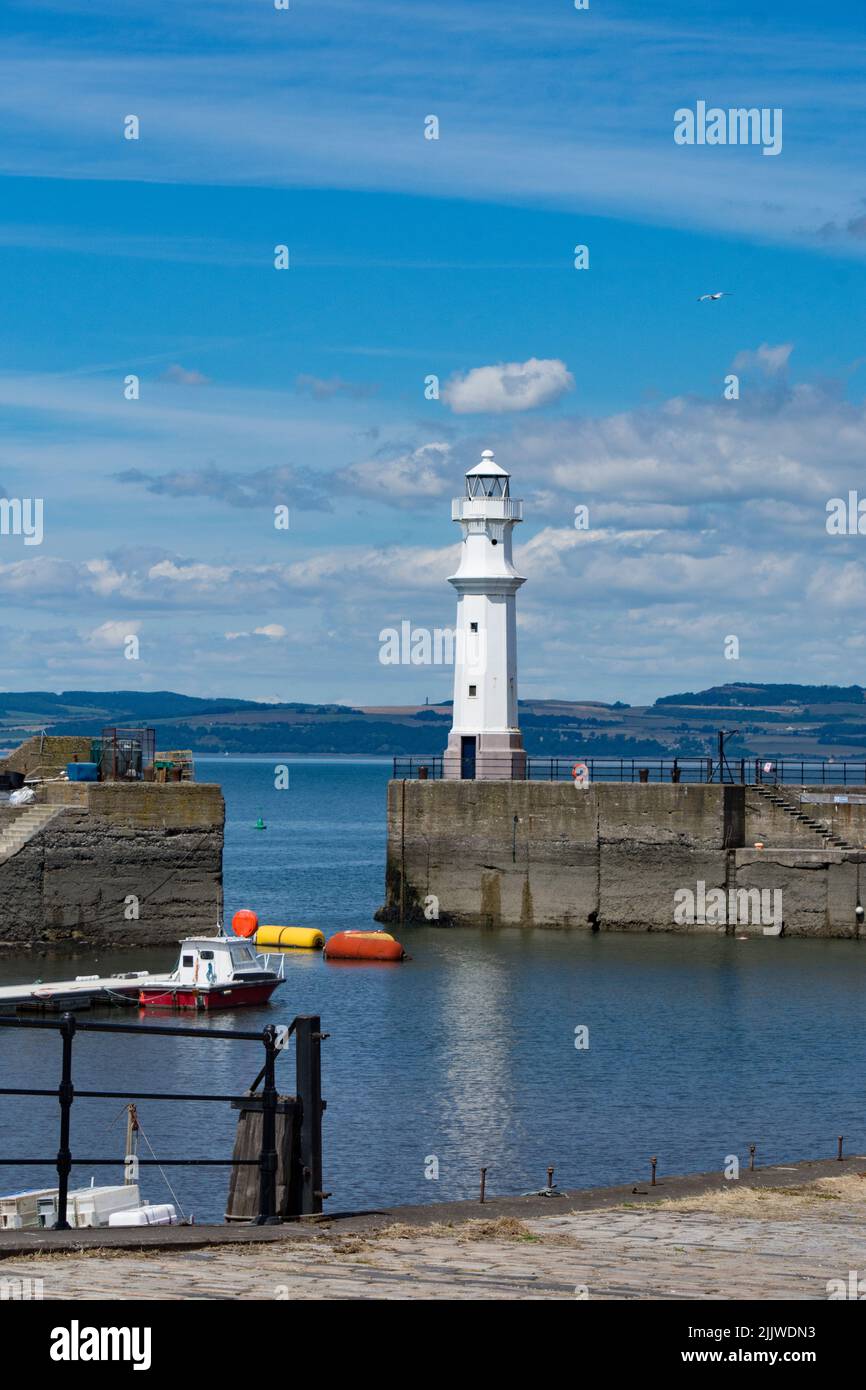 The lighthouse at Newhaven Harbour - a small fishing boat harbour on ...
