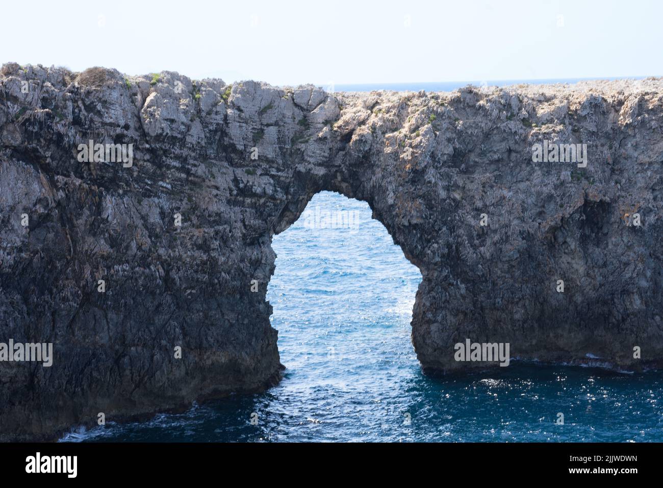 A view of an arch in font den Gil in Menorca, Spain Stock Photo - Alamy