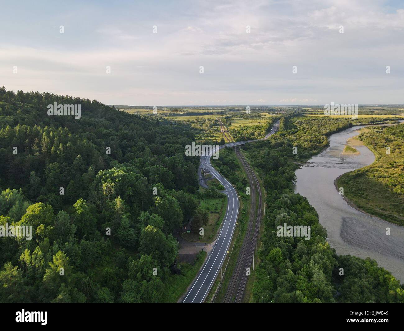 An aerial view of a road in Ukraine surrounded by mountains Stock Photo ...