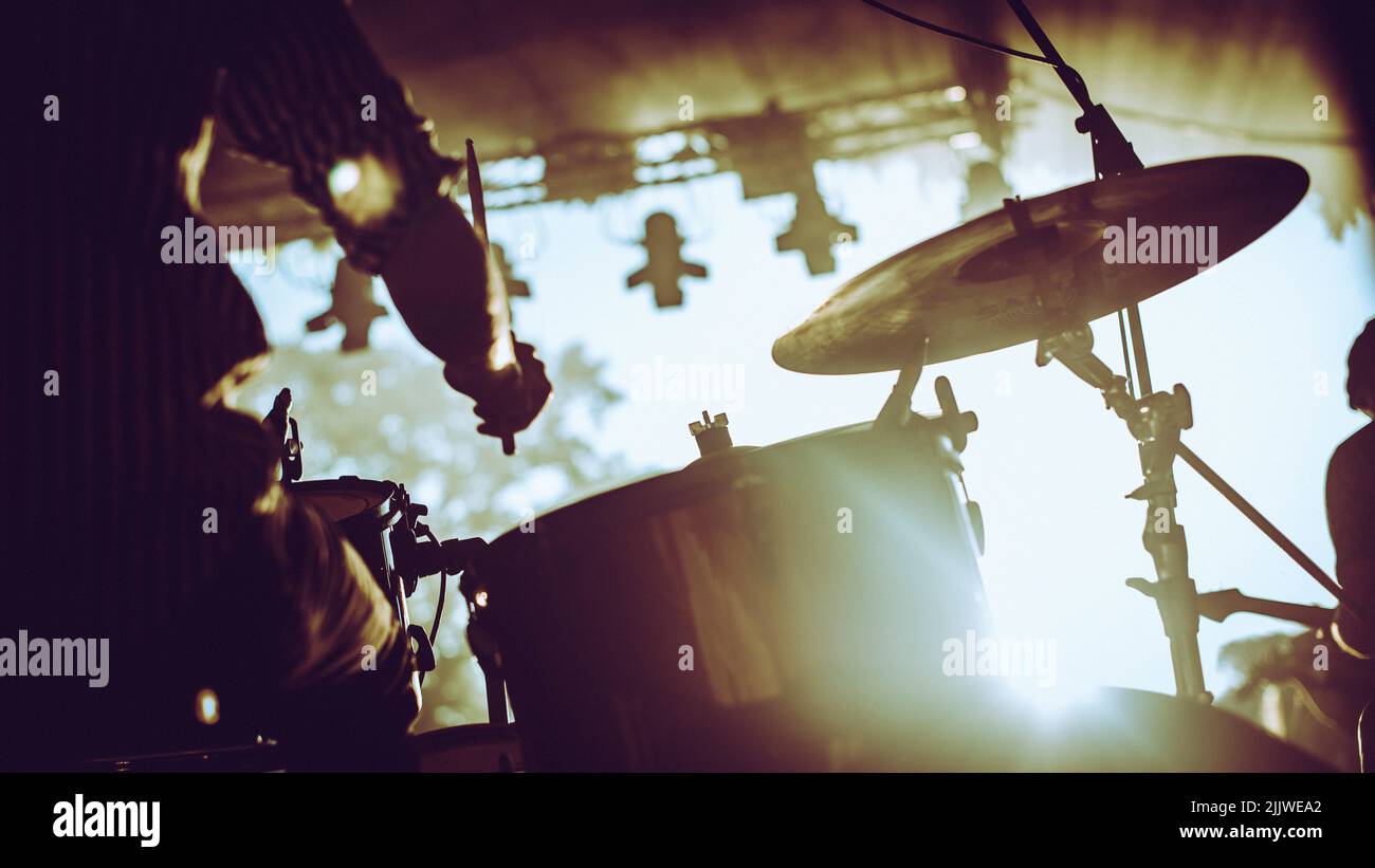Drummer in concert playing drums on stage. Music band and live music ...