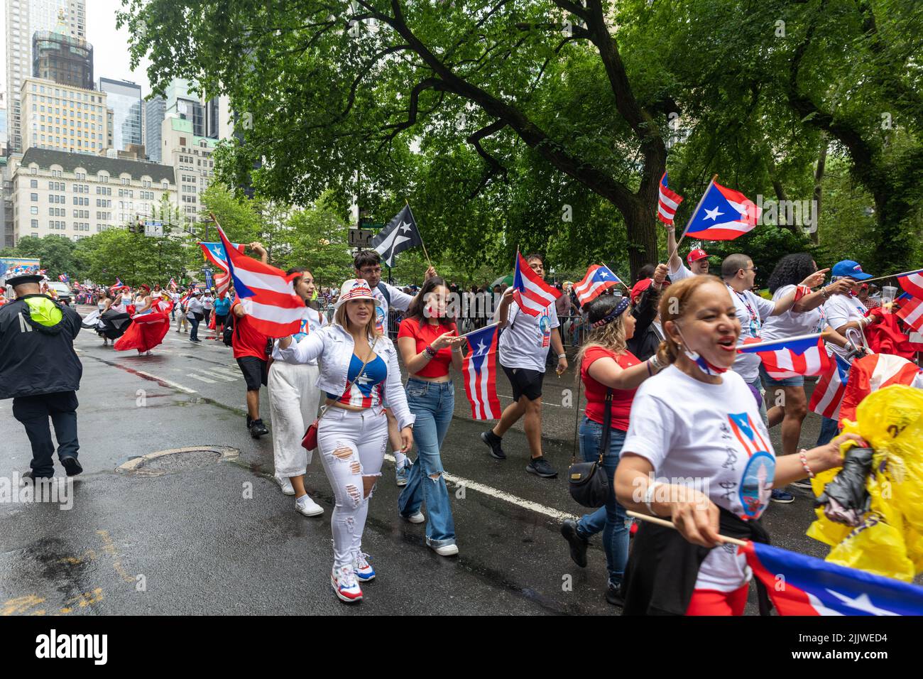 Crowd celebrating the Puerto Rican Day Parade in New York City holding ...